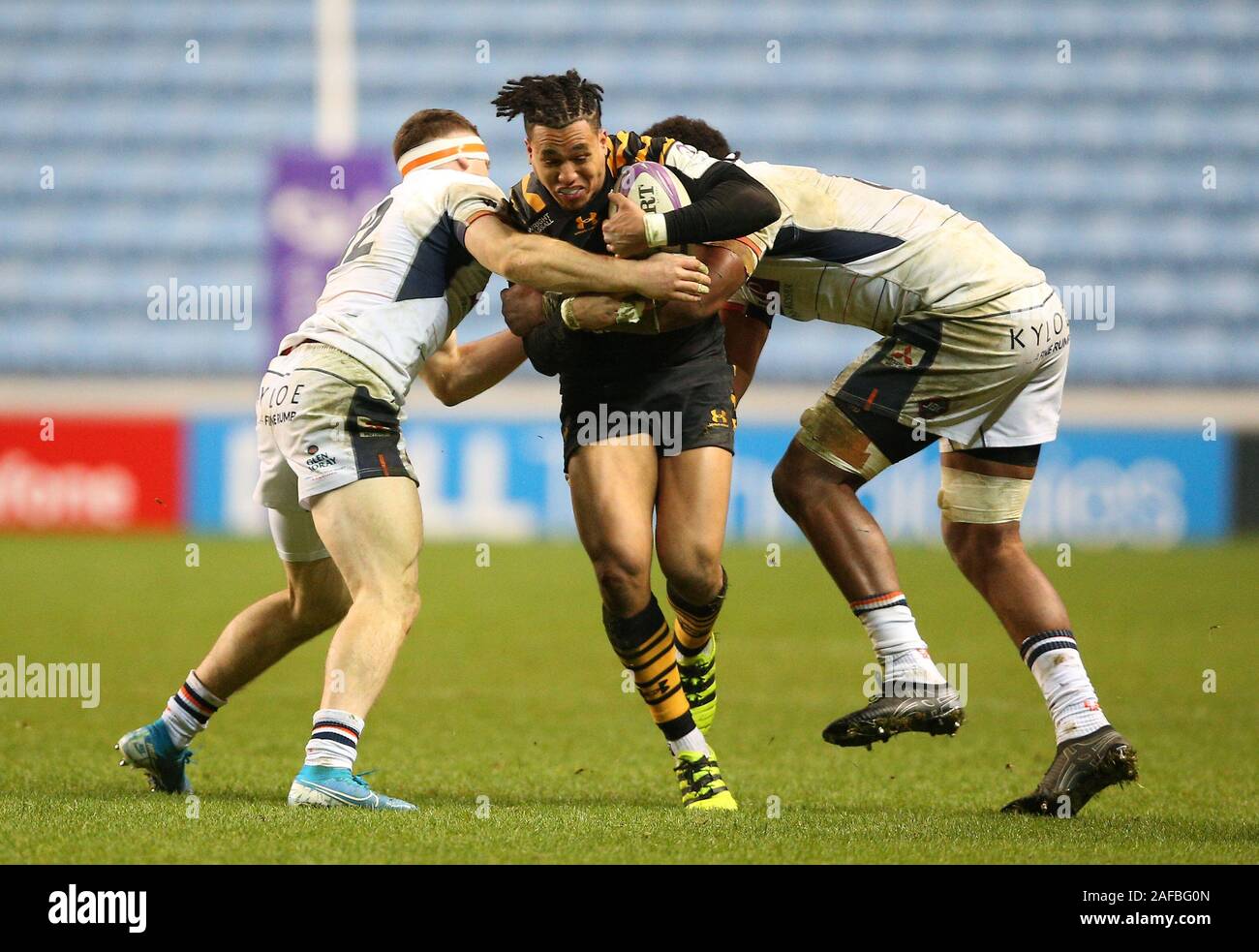 Wasps' Marcus Watson is tackled by Edinburgh Rugby's George Taylor ...