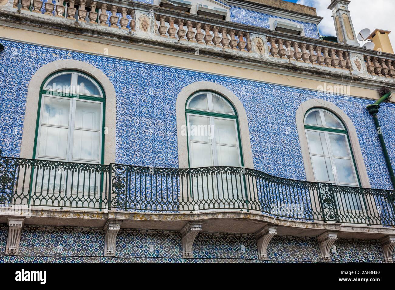 Traditional architecture of the facades covered with ceramic tiles ...