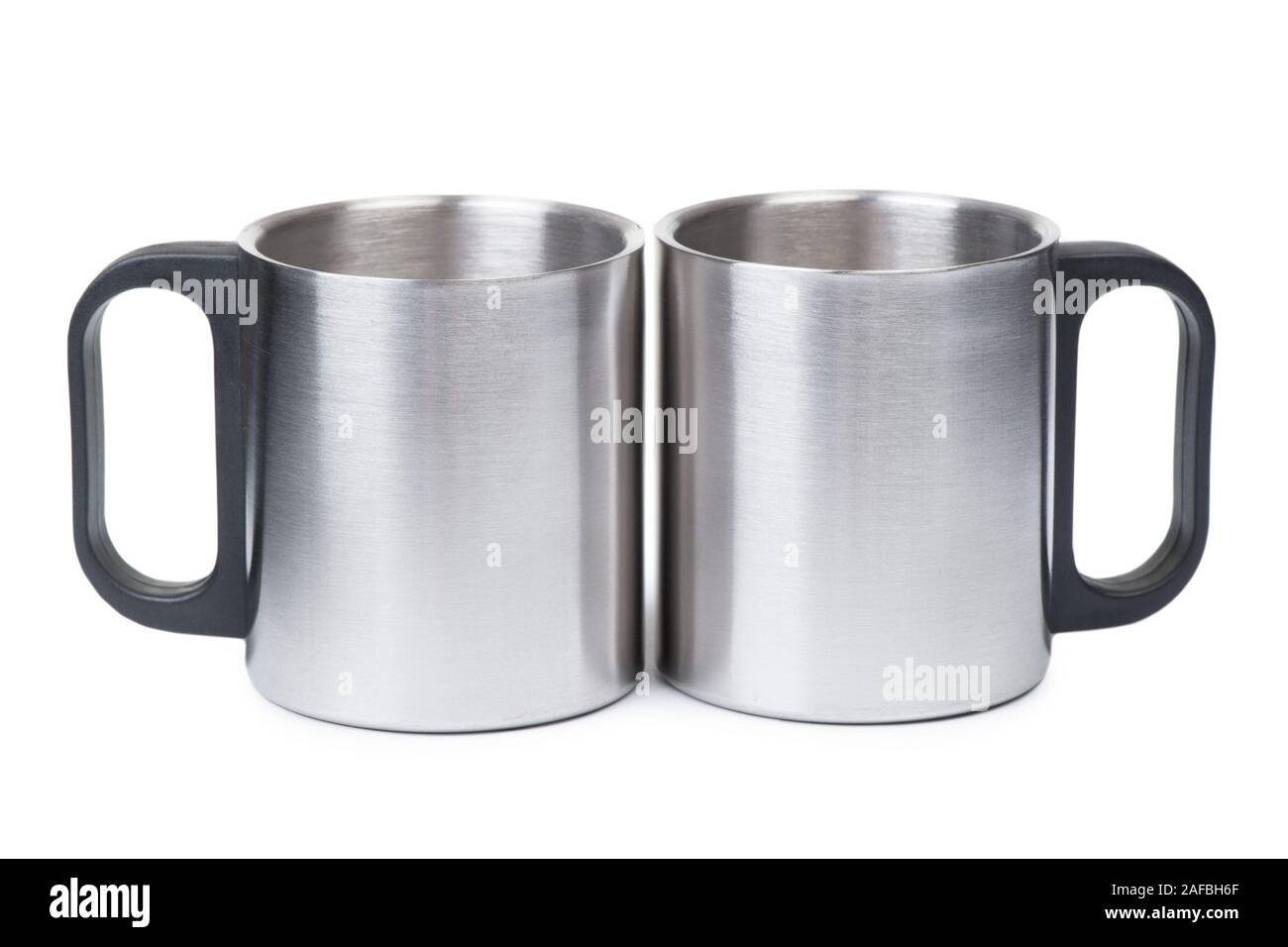 Empty metal mugs isolated on white background Stock Photo - Alamy