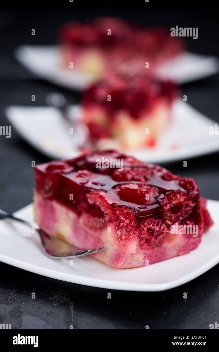 Fresh made Raspberry Cake on a rustic slate slab (close-up shot ...