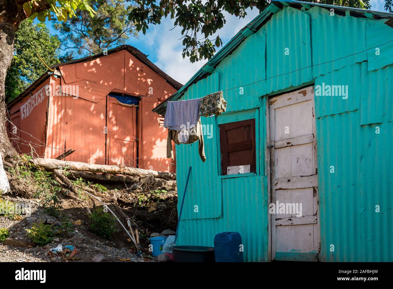 dramatic image of poor wooden colourful Haitian home in the mountains ...