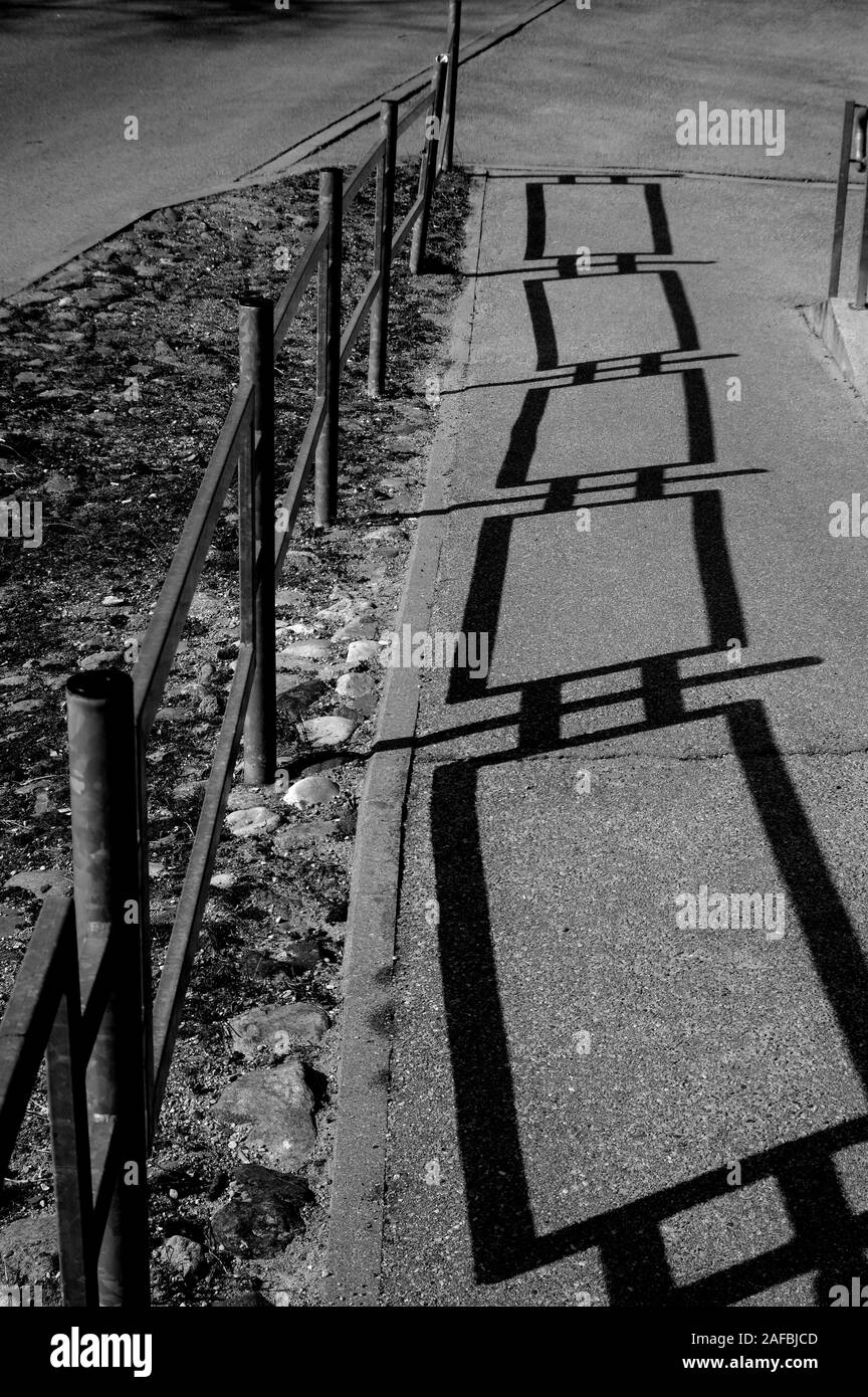 Metal railings roadside background view Black and White Stock Photos ...