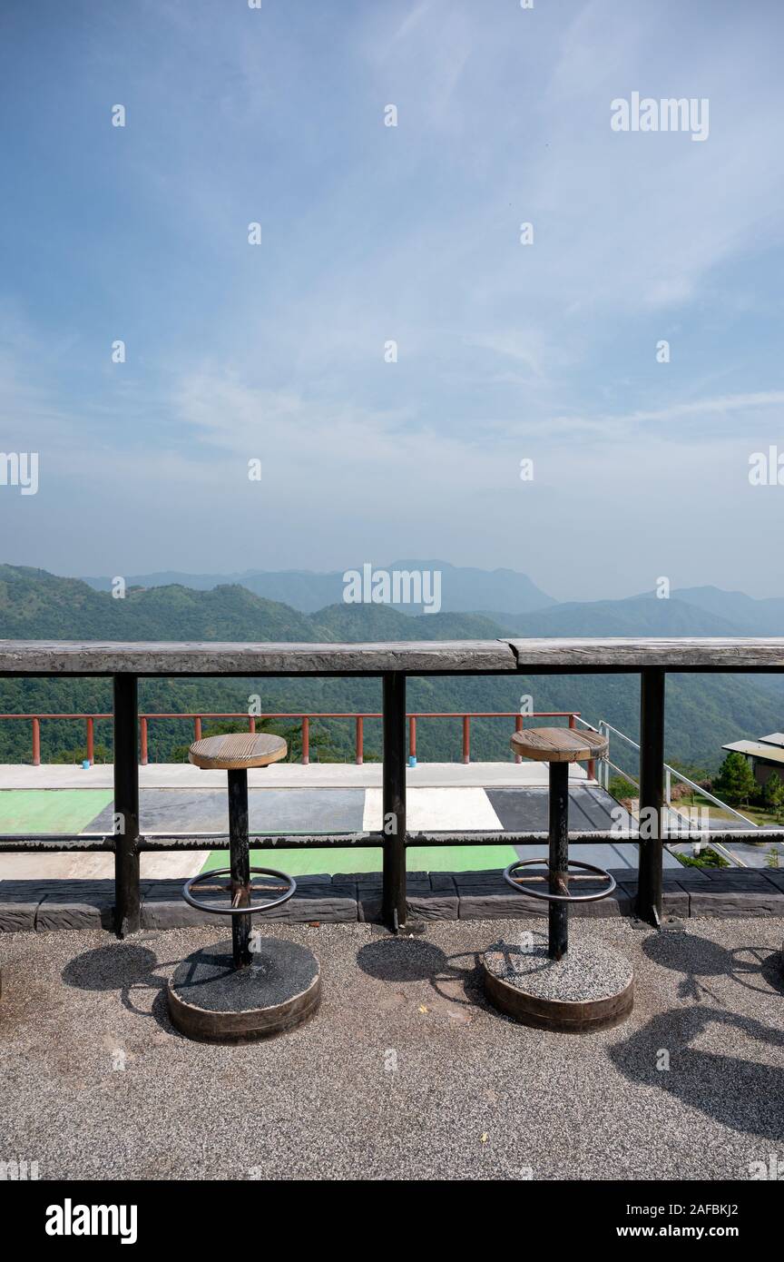 Wooden bar with chairs on mountain view with blue sky in the cafe Stock ...