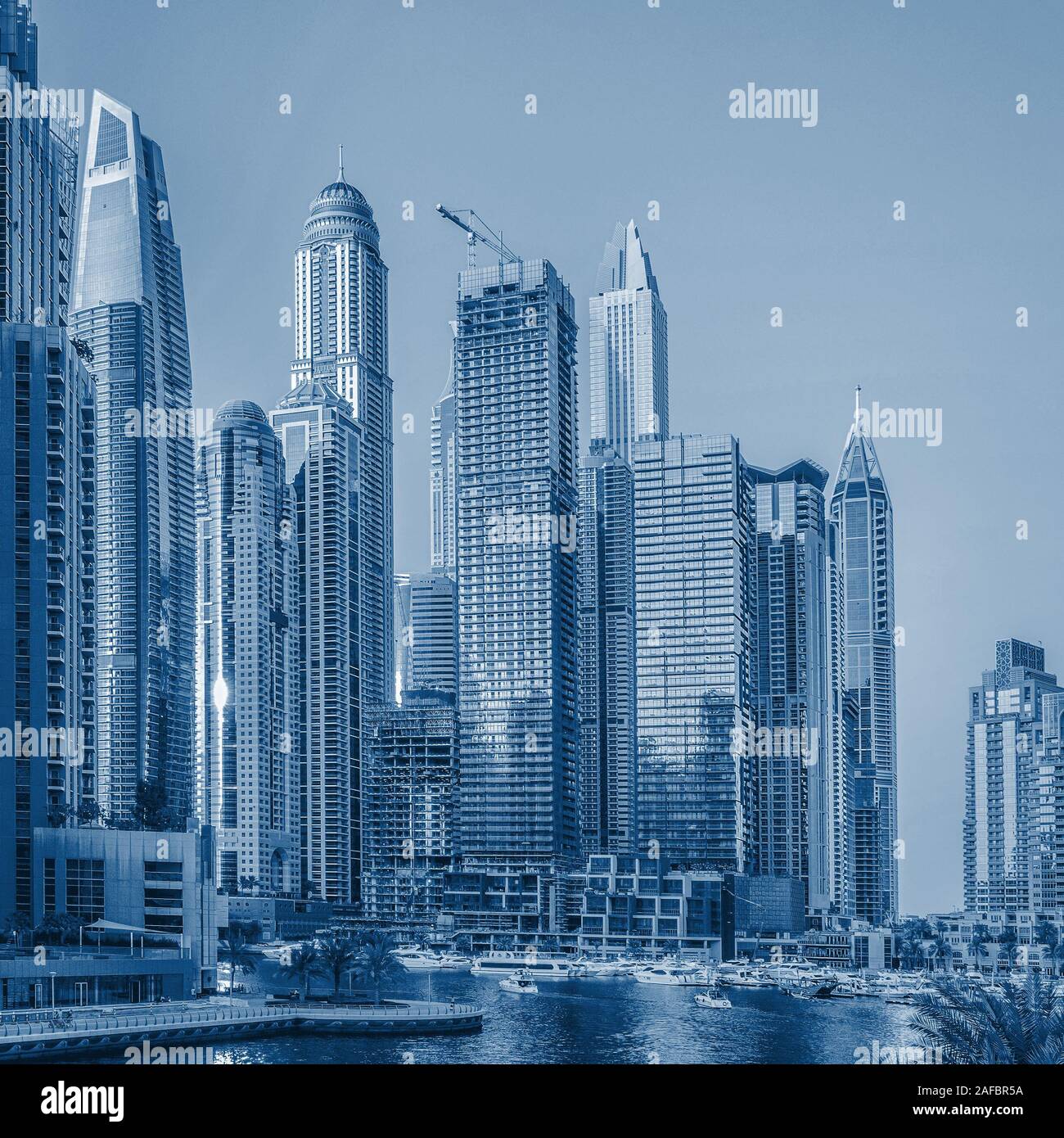 Dubai Marina at sunset, United Arab Emirates.Blue abstract background ...