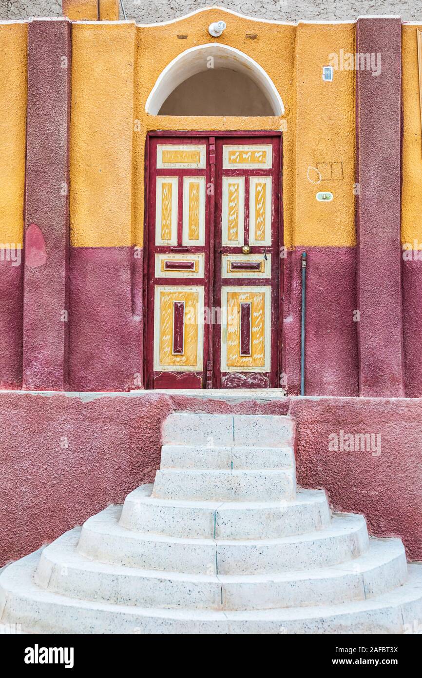 Africa, Egypt, Aswan. October 9. 2018. Doorway painted in the typical ...