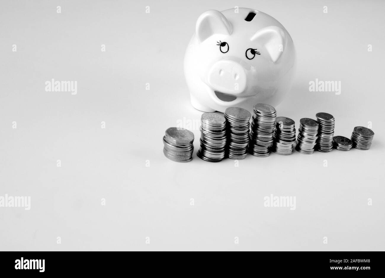Investment concept stacks coins Black and White Stock Photos & Images ...