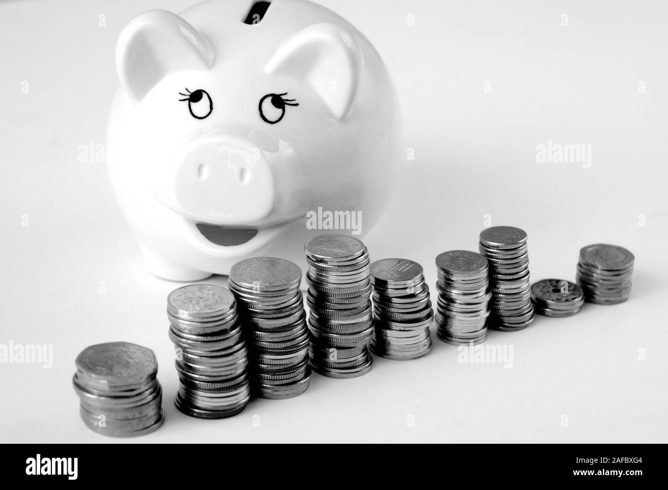 Coin stacks Black and White Stock Photos & Images - Alamy