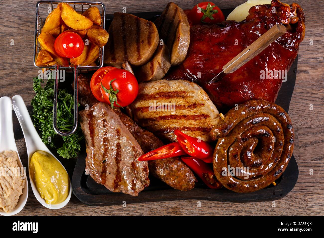 Grilled meat mix plate - beef, pork and chicken Stock Photo - Alamy