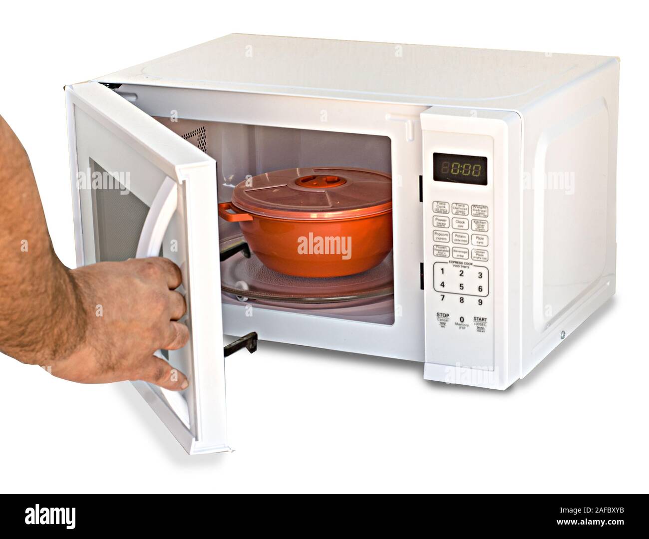 Microwave oven and hand Stock Photo - Alamy