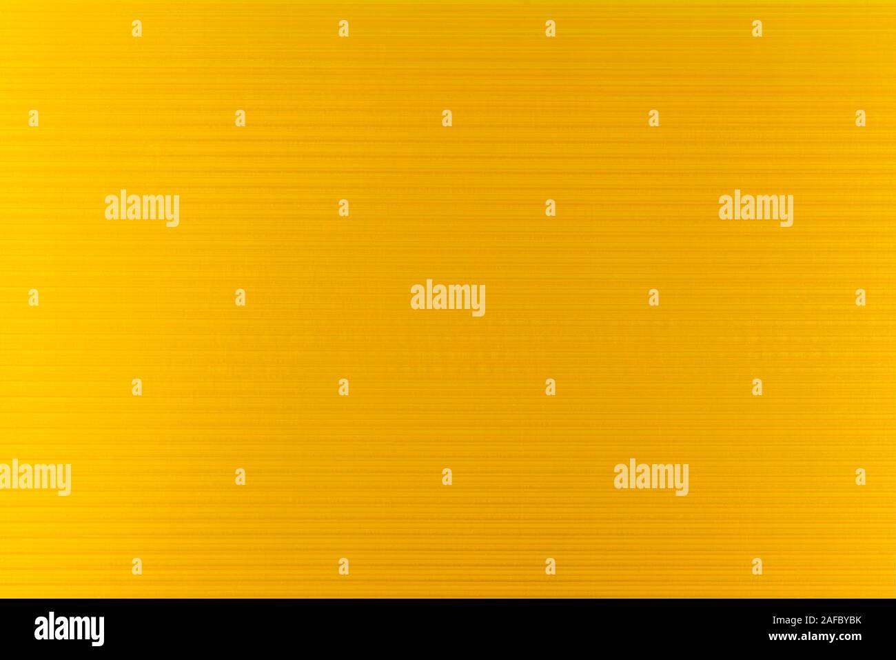 Real texture made of yellow rubber in the shape of horizontal stripes ...