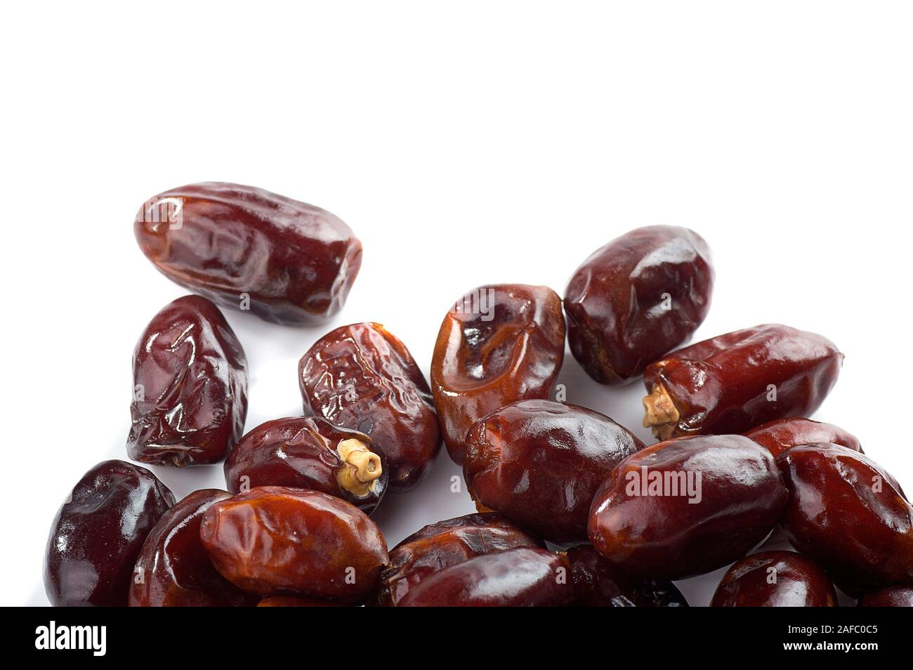 Dates on white background. Dried dates fruit Stock Photo - Alamy