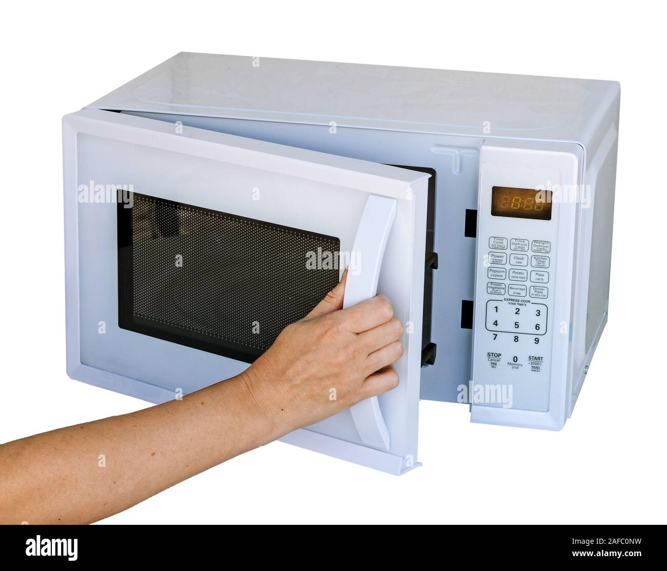 Microwave oven and hand Stock Photo - Alamy