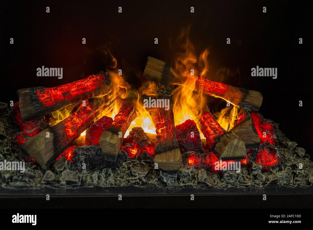 Fire burns in a fireplace. Fire to keep warm Stock Photo - Alamy