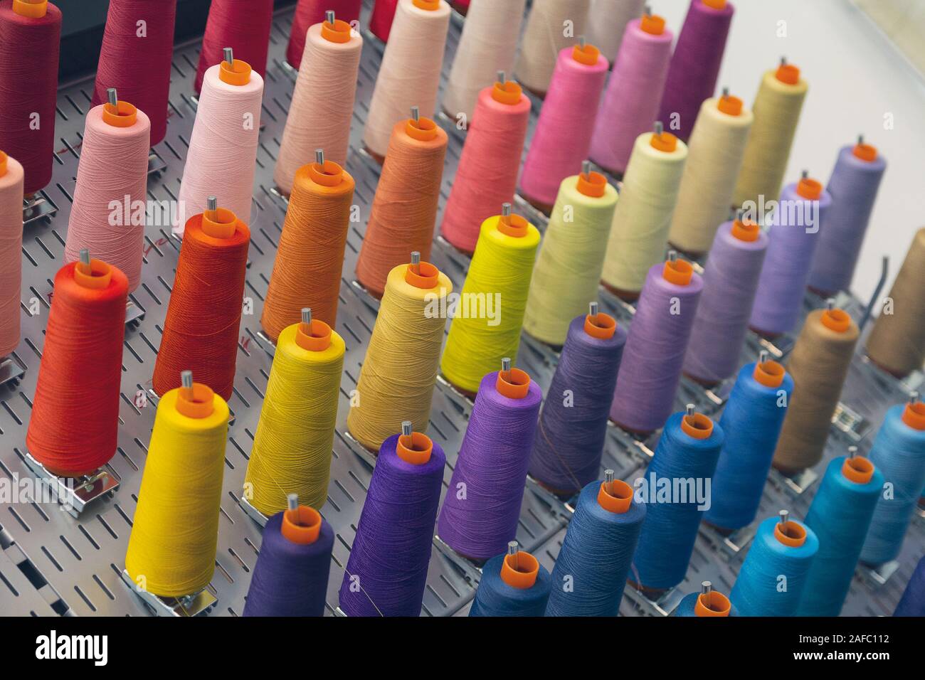 Colorful embroidery thread rolls for sewing machine. Industry Stock ...