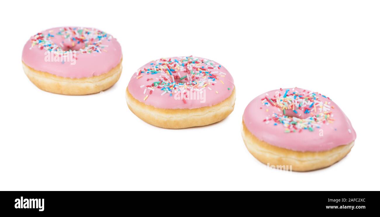 Some fresh made Donuts isolated on white background (close-up shot ...