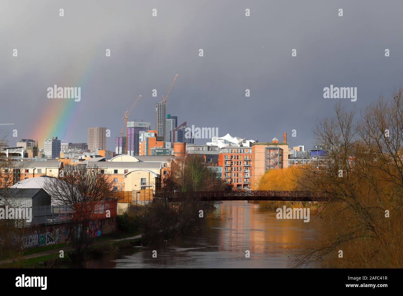 A rainbow appers alongside Leeds city skyline during rain showers Stock ...