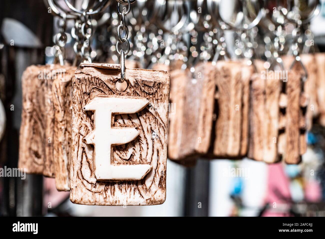 Alphabetical keychains close-up. Close up of letter E in front Stock ...
