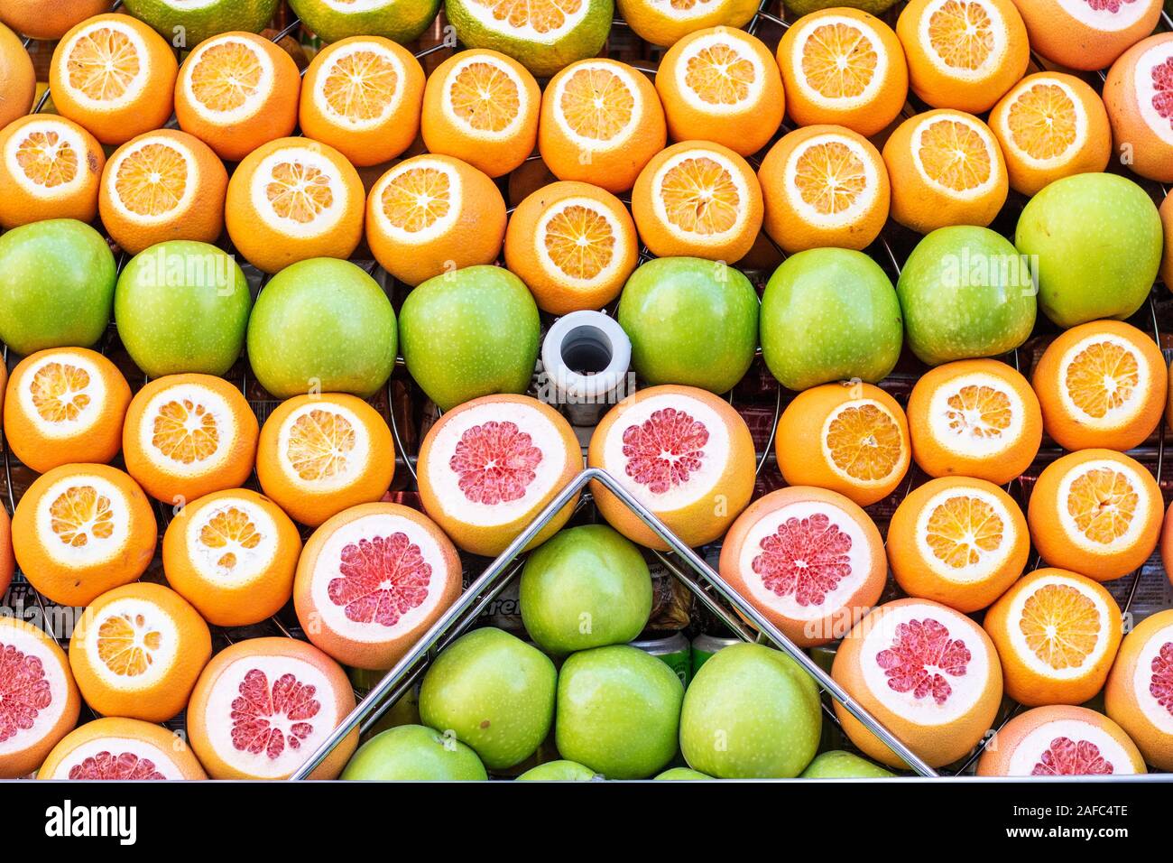 Orange and green apple lined fruit. Bench with triangular patterns on ...