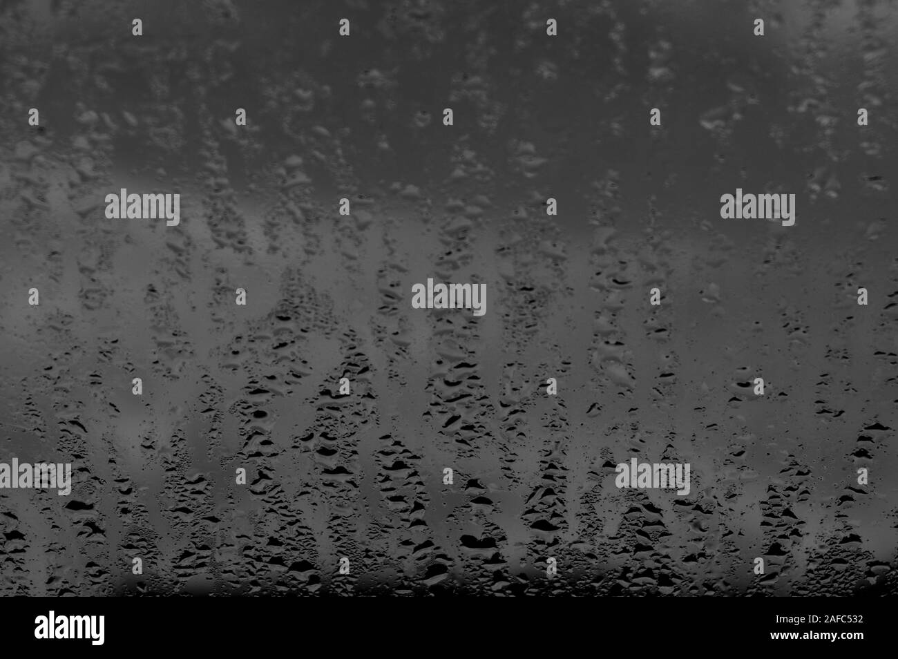 Condensation raindrops on glass window Black and White Stock Photos ...