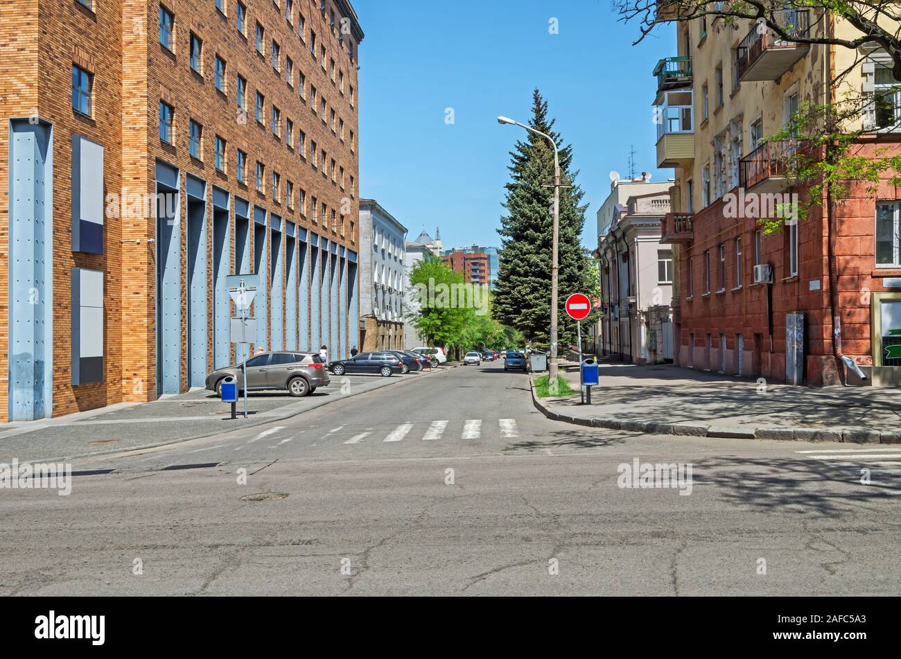 Crossroads streets and sidewalks of regional city with one-way traffic ...