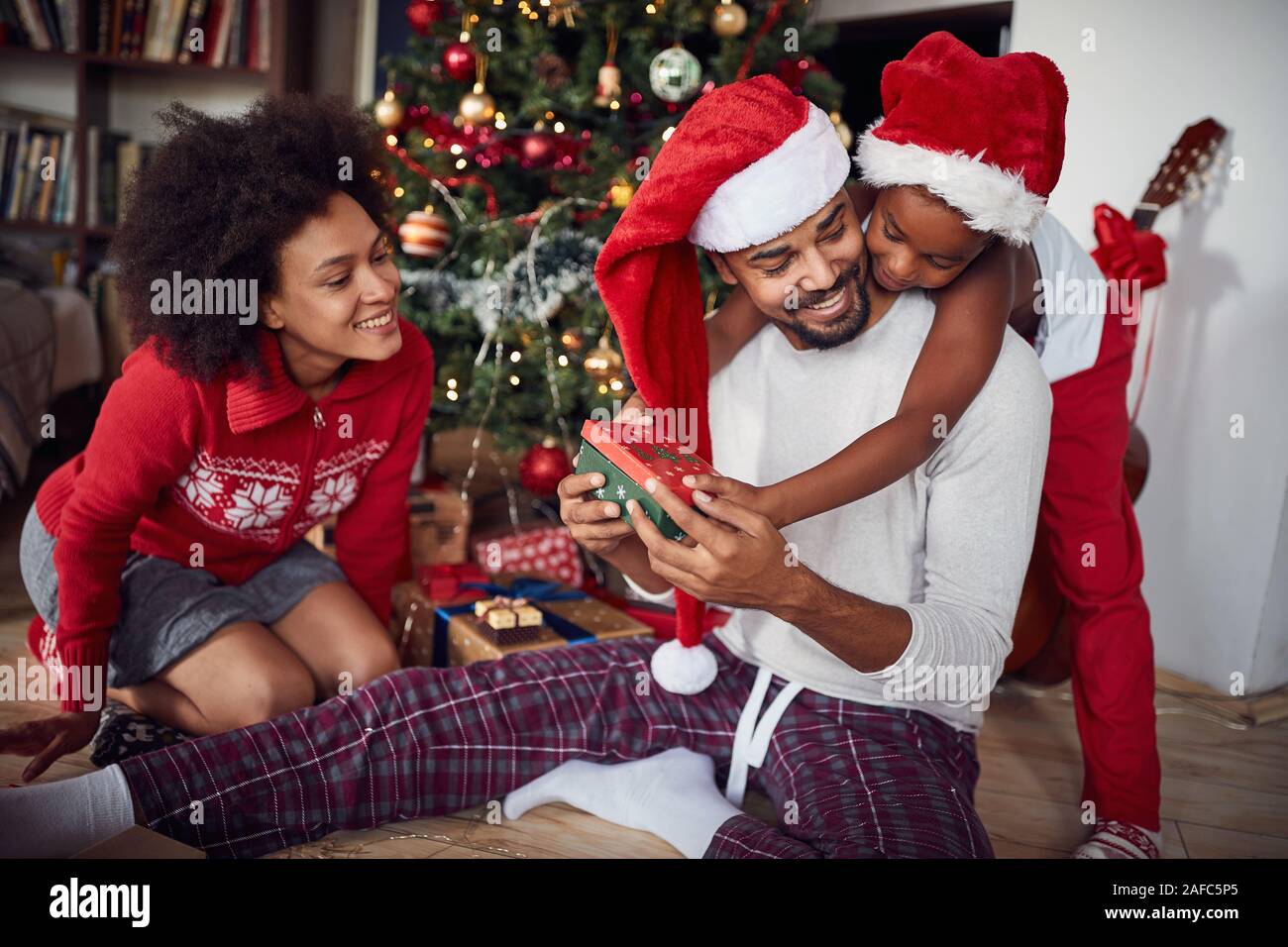 Family Celebrating Christmas Together.Smiling father and his daughter ...