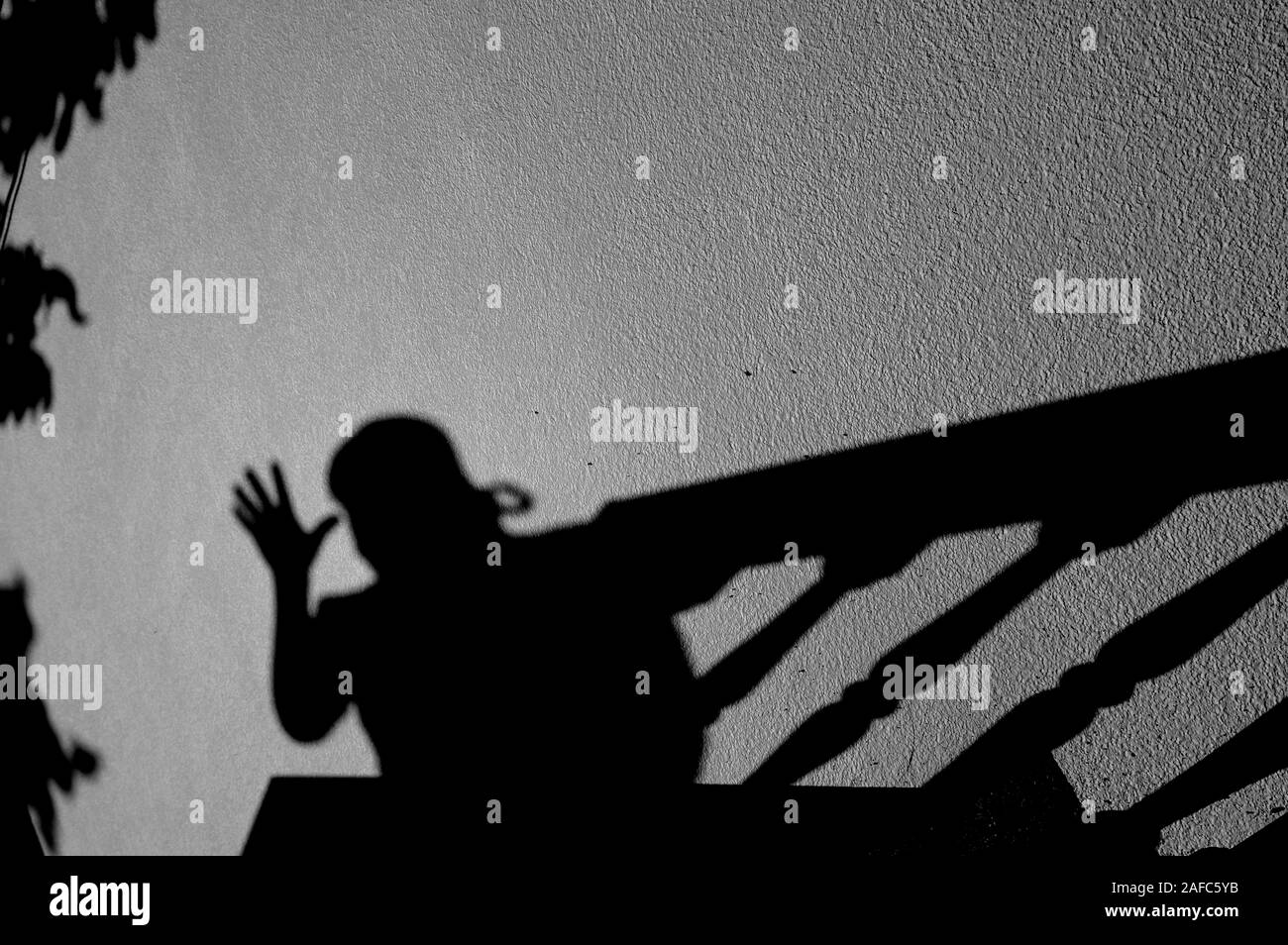 Human silhouette on wall Black and White Stock Photos & Images - Alamy