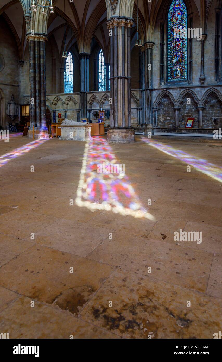 Sunlight through stained glass windows in forming a colourful pattern ...