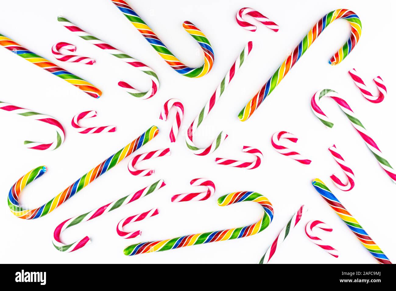 Background made of colorful candy canes, isolated on a white background ...