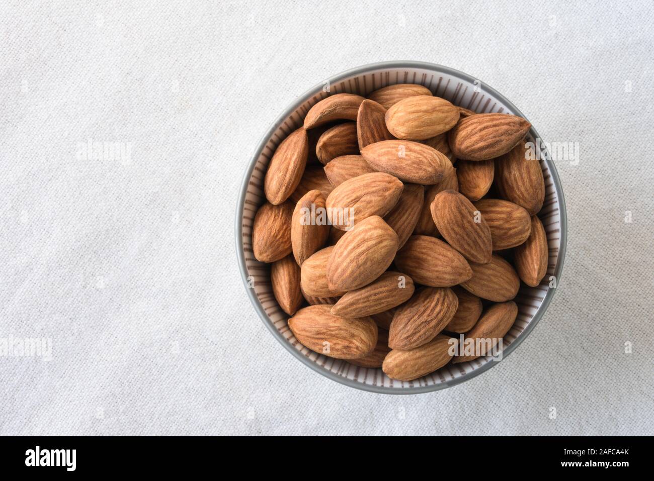 Roasted Unsalted Almonds in a Bowl Stock Photo - Alamy