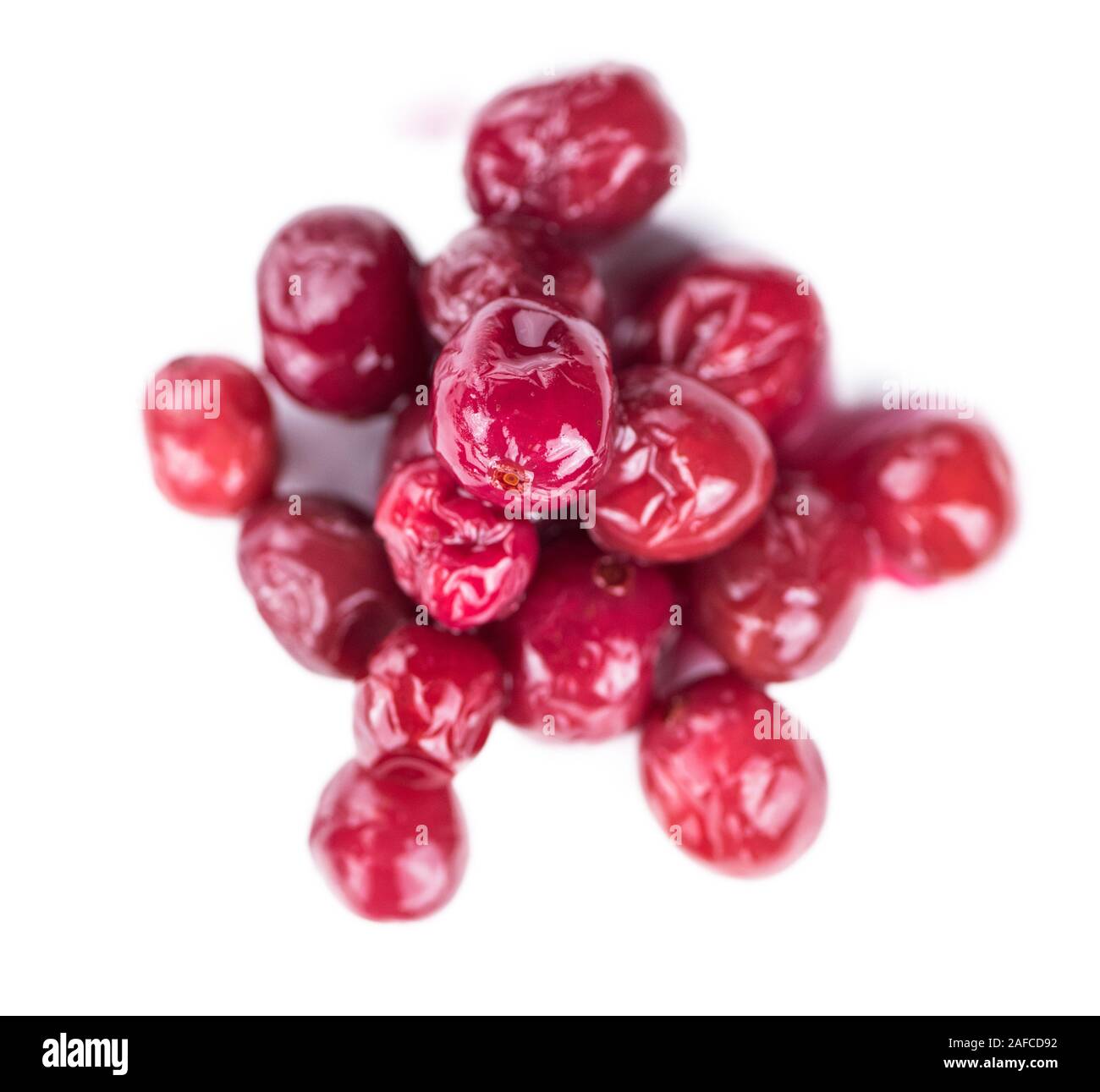 Preserved Cranberries as detailed close-up shot isolated on white ...