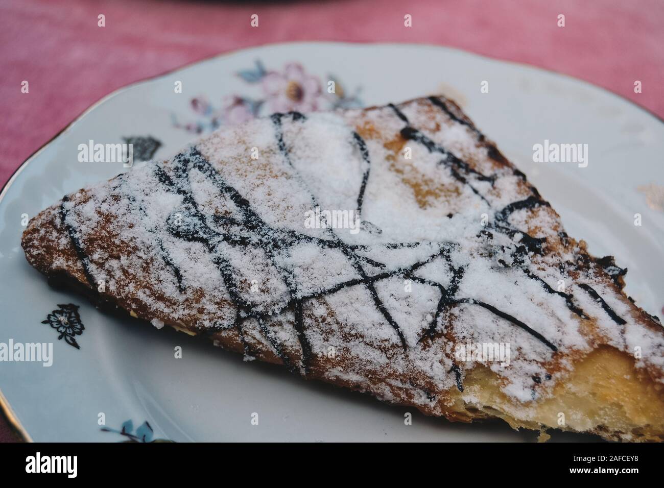 Chocolate pastry with impalpable sugar Stock Photo - Alamy