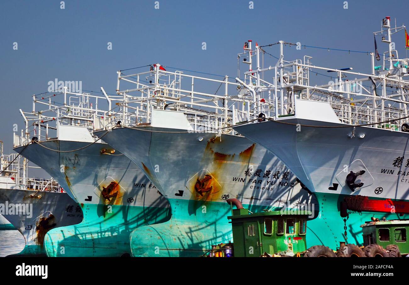KAOHSIUNG, TAIWAN -- DECEMBER 1, 2019: A row of large ocean-going ...