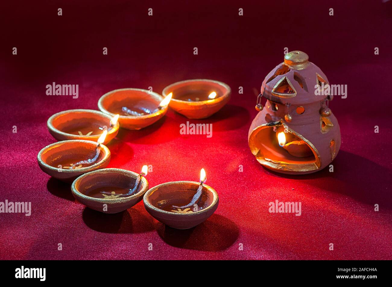 Clay diya lamps lit during Diwali Celebration. Greetings Card Design ...