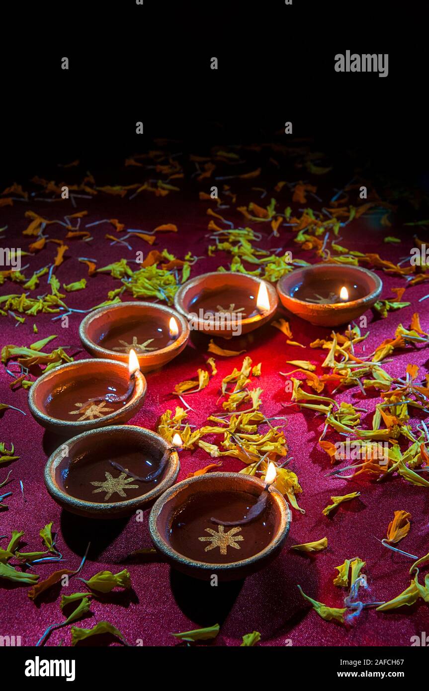Clay diya lamps lit during Diwali Celebration. Greetings Card Design ...