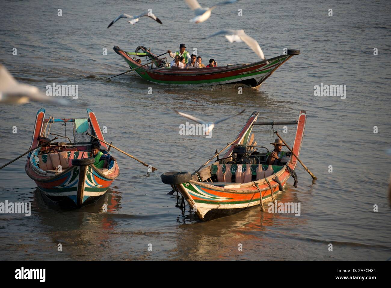 Yangon River, seagulls and colourful boats, Yangon, Myanmar Stock Photo ...