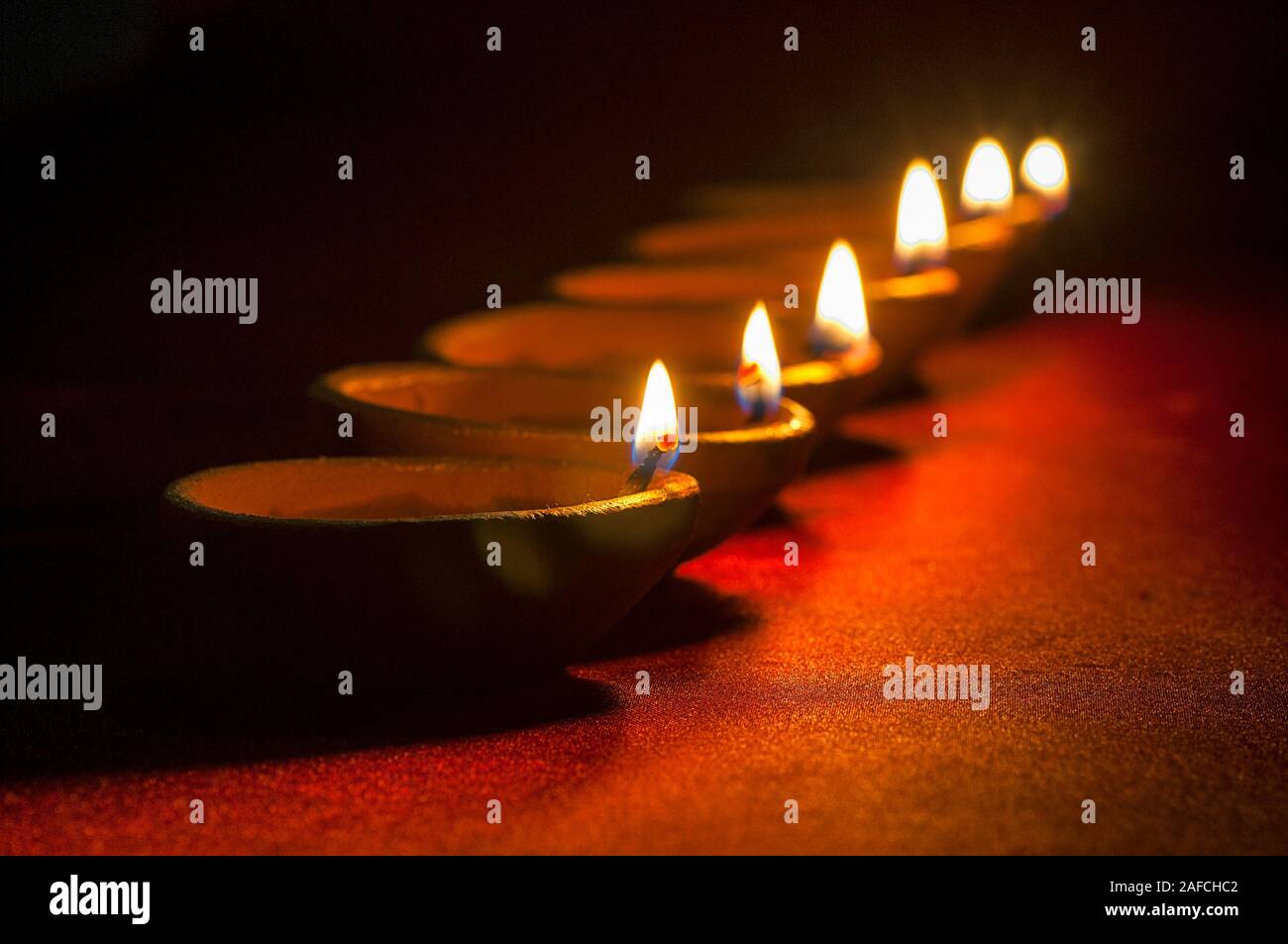 Clay diya lamps lit during Diwali Celebration. Greetings Card Design ...