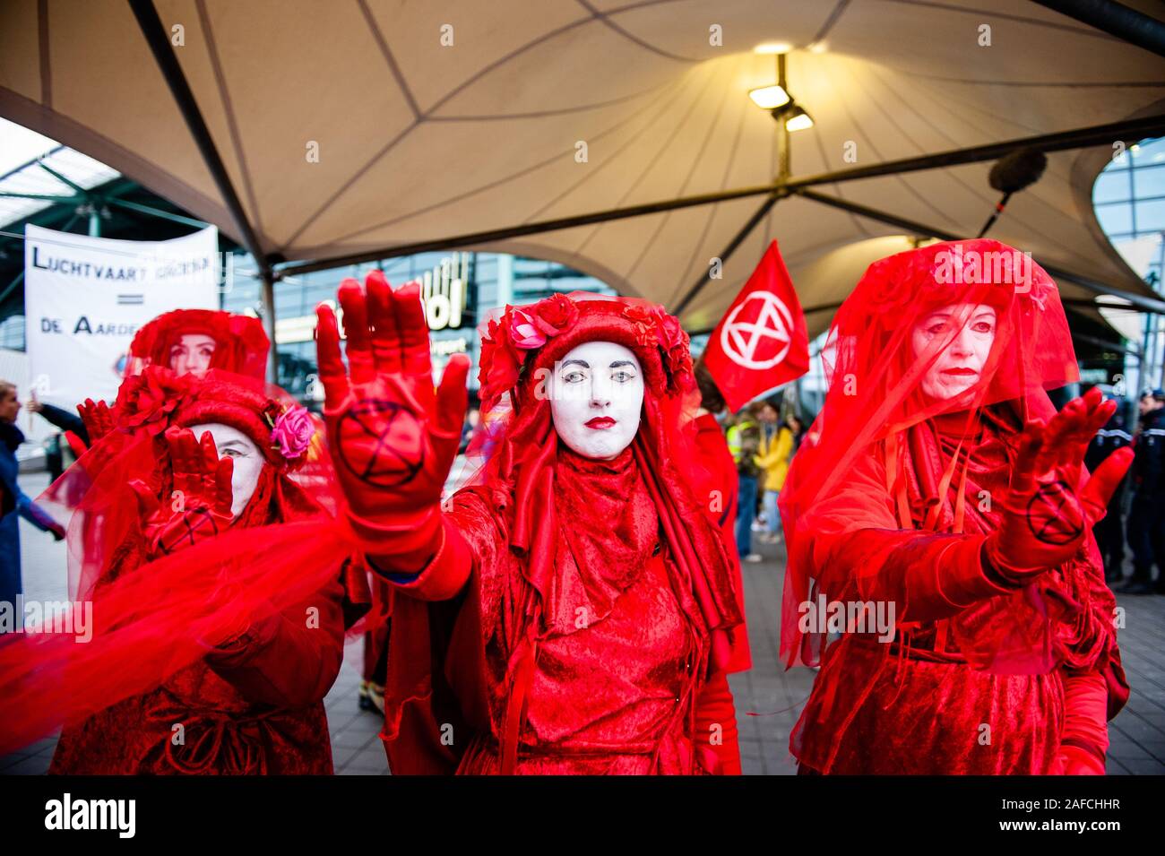 A group of Red Rebels activists show off their hands with the logo of ...