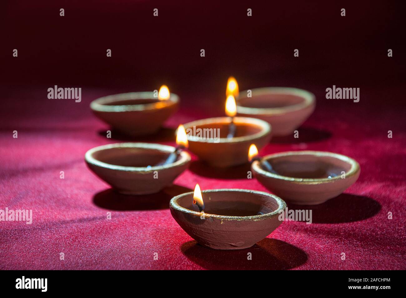 Clay diya lamps lit during Diwali Celebration. Greetings Card Design ...