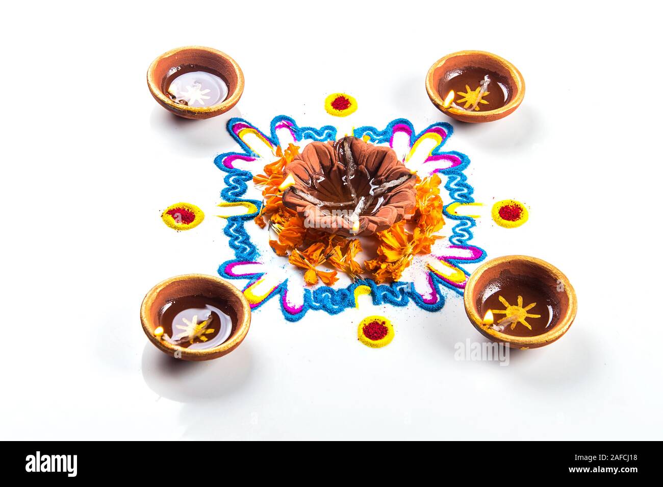 Clay diya lamp lit during diwali festival. Clay Diya on Rangoli. Happy ...