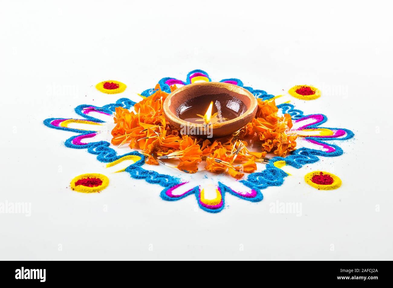 Clay diya lamp lit during diwali festival. Clay Diya on Rangoli. Happy ...