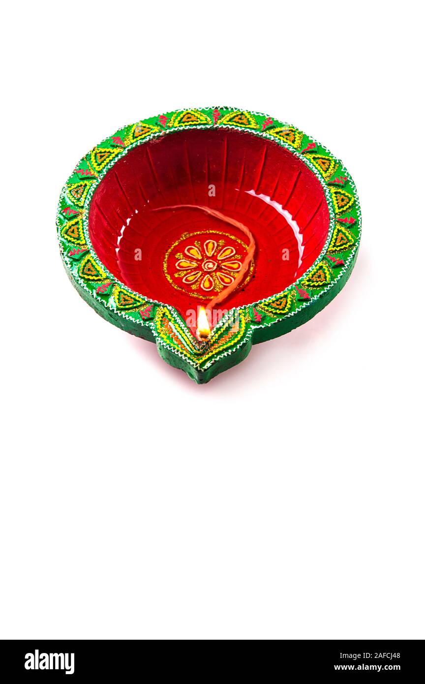 Single Clay diya lamp lit during diwali festival. Happy Diwali ...