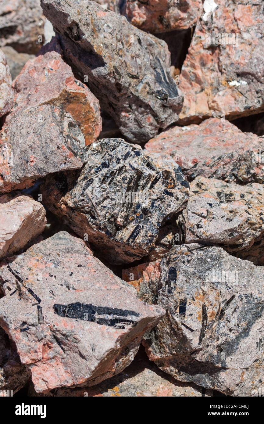 Large granite rocks with interesting composing features stacked in a ...