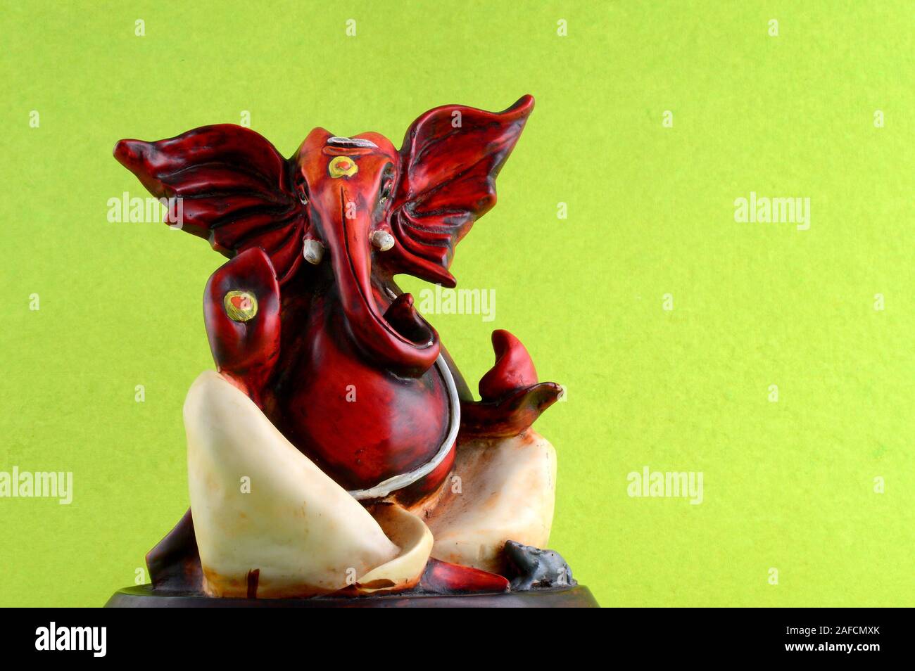 Hindu God Ganesha. Ganesha Idol on Green Background Stock Photo - Alamy