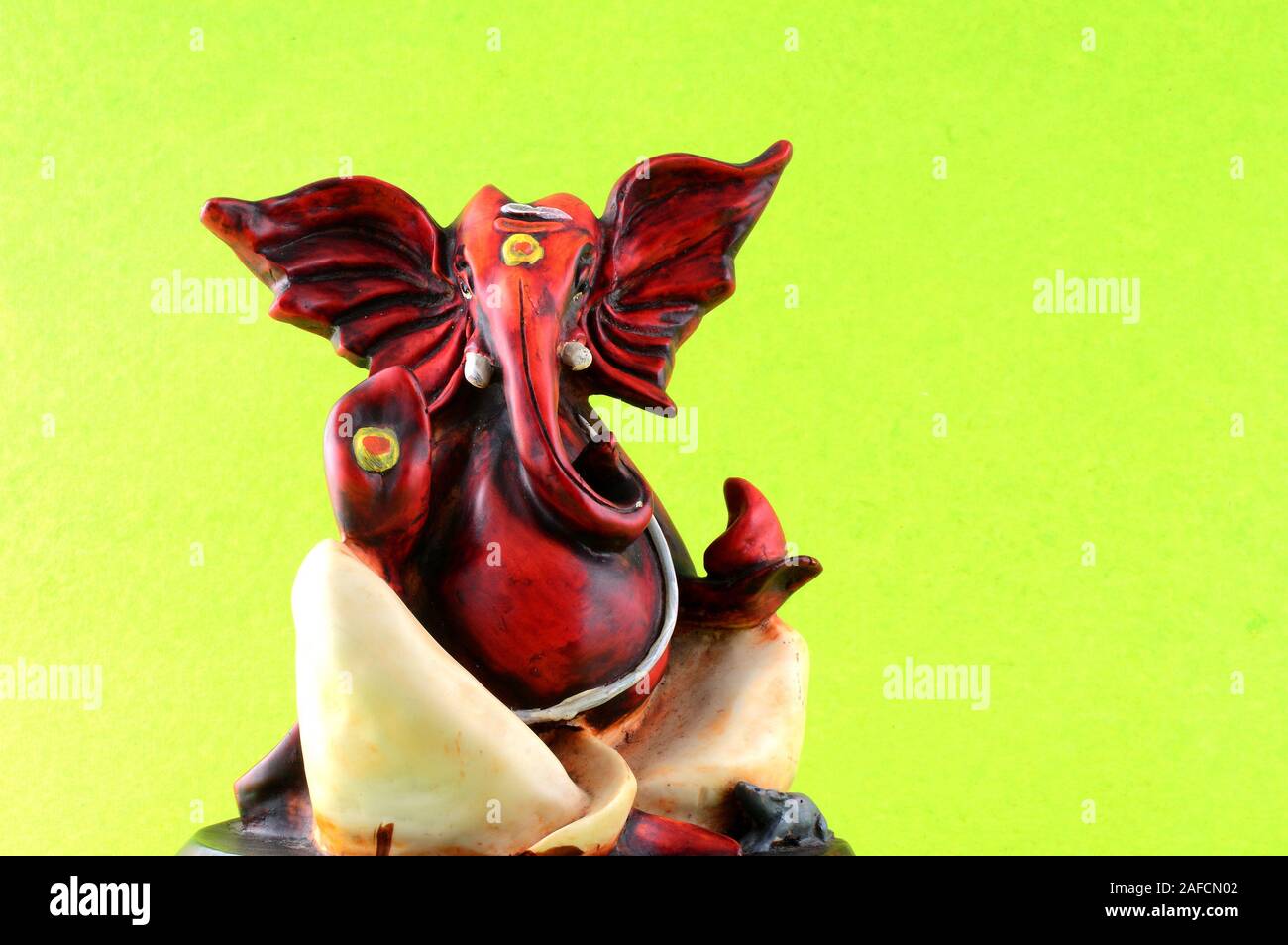 Hindu God Ganesha. Ganesha Idol on Green Background Stock Photo - Alamy