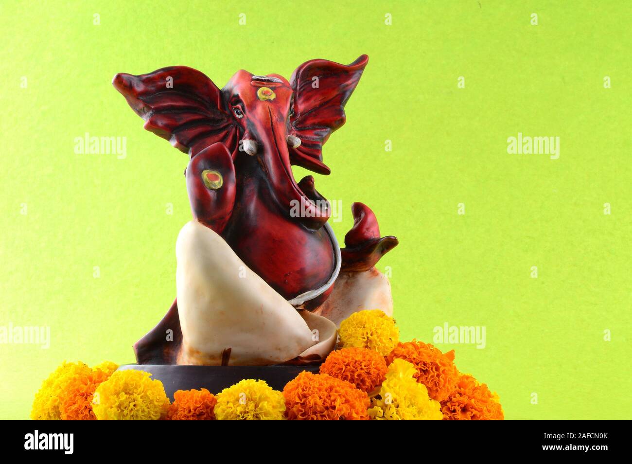 Hindu God Ganesha. Ganesha Idol on Green Background Stock Photo - Alamy