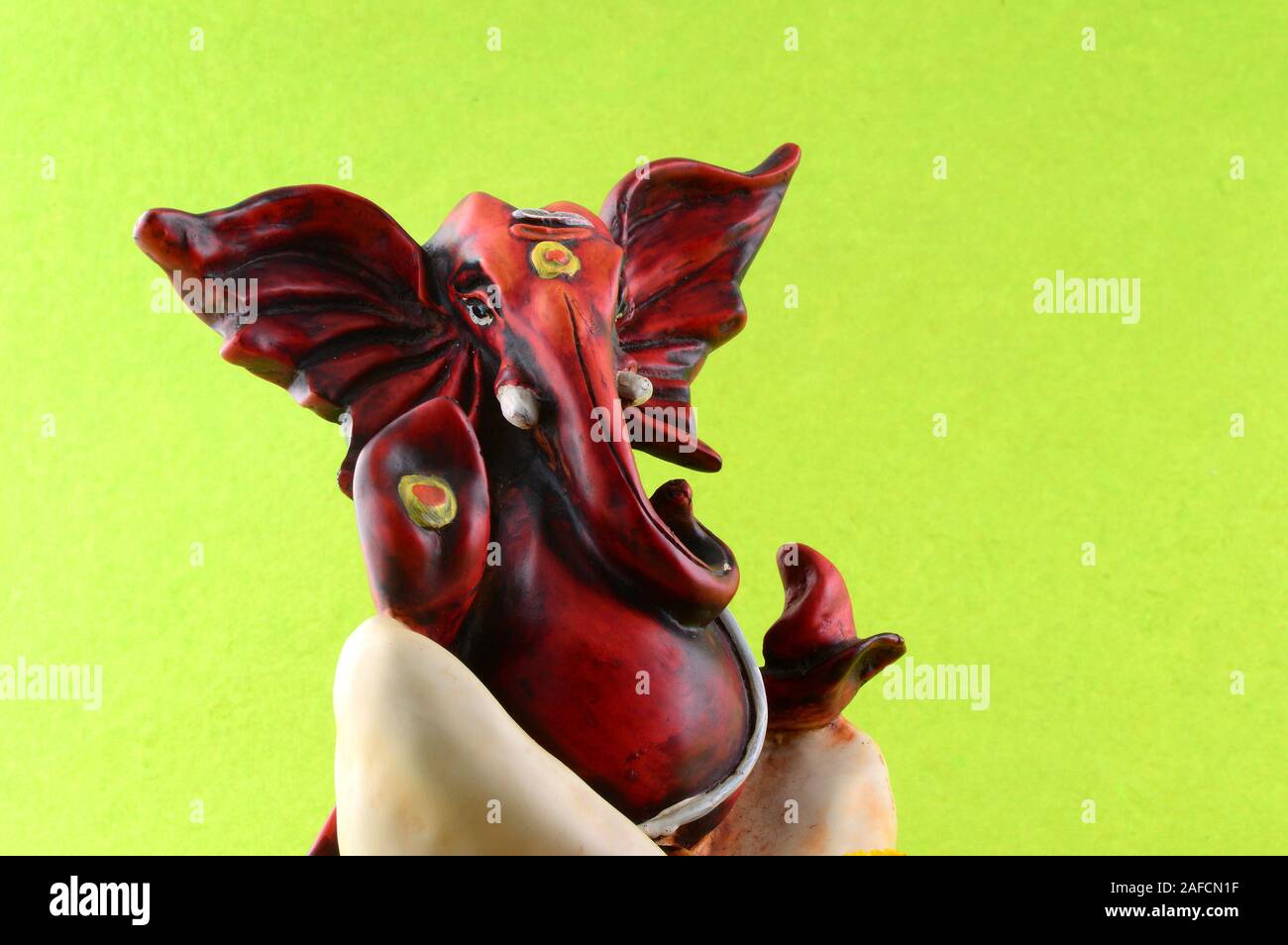 Hindu God Ganesha. Ganesha Idol on Green Background Stock Photo - Alamy