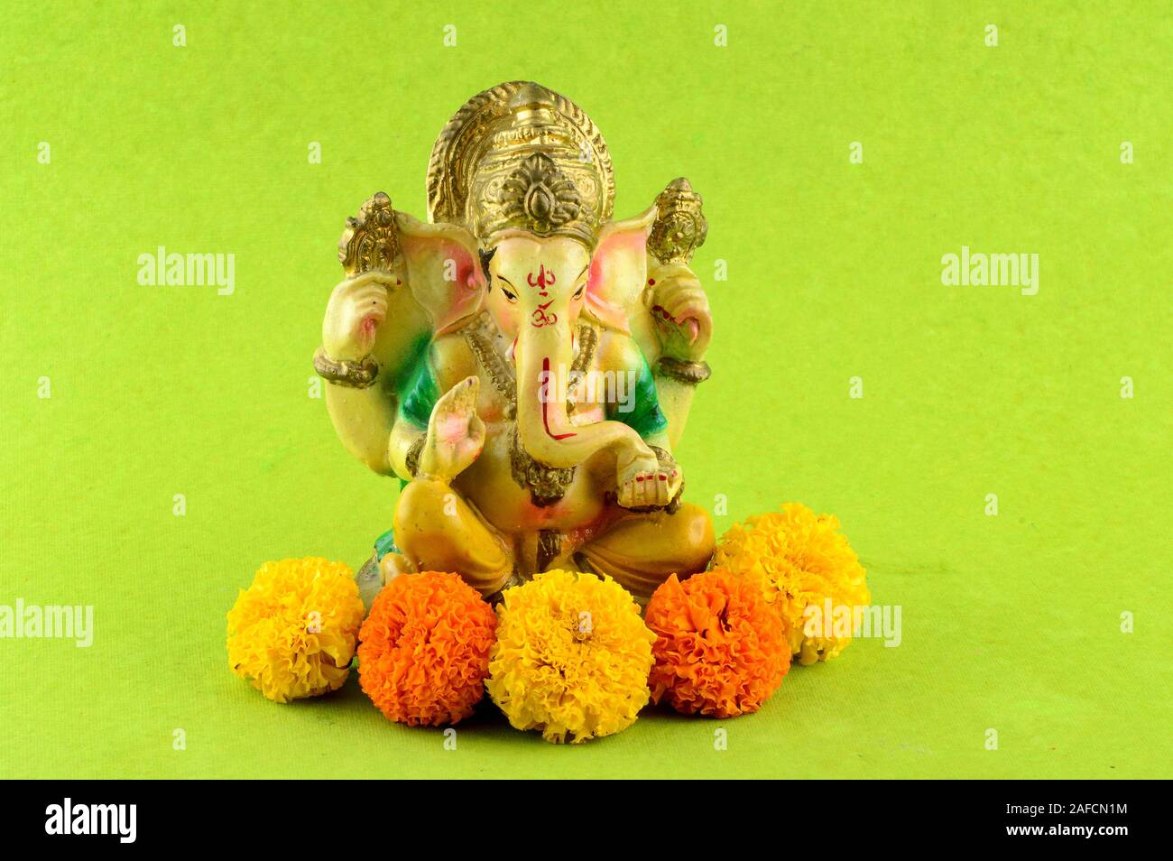 Hindu God Ganesha. Ganesha Idol on Green Background Stock Photo - Alamy