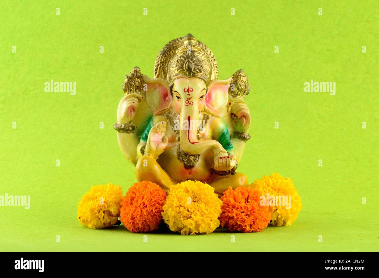 Hindu God Ganesha. Ganesha Idol on Green Background Stock Photo - Alamy