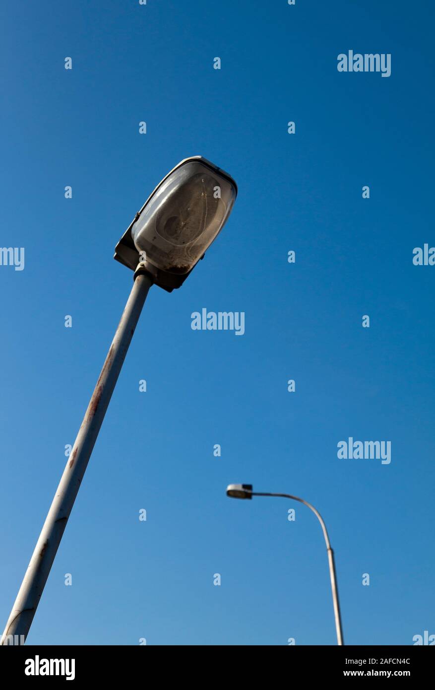Photo of two street lamps during a day on a clear sky Stock Photo - Alamy