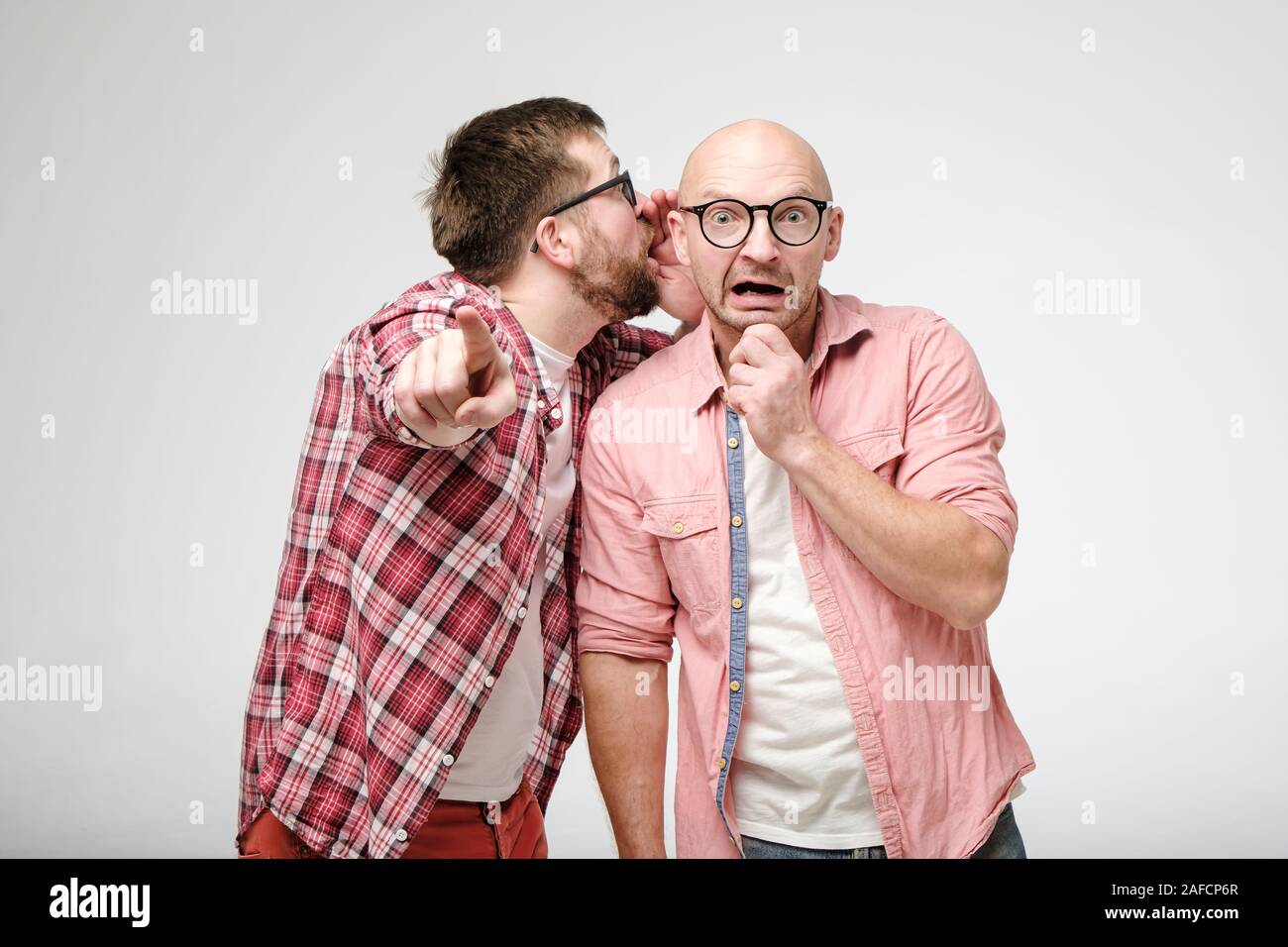 Man whispering into ear hi-res stock photography and images - Alamy